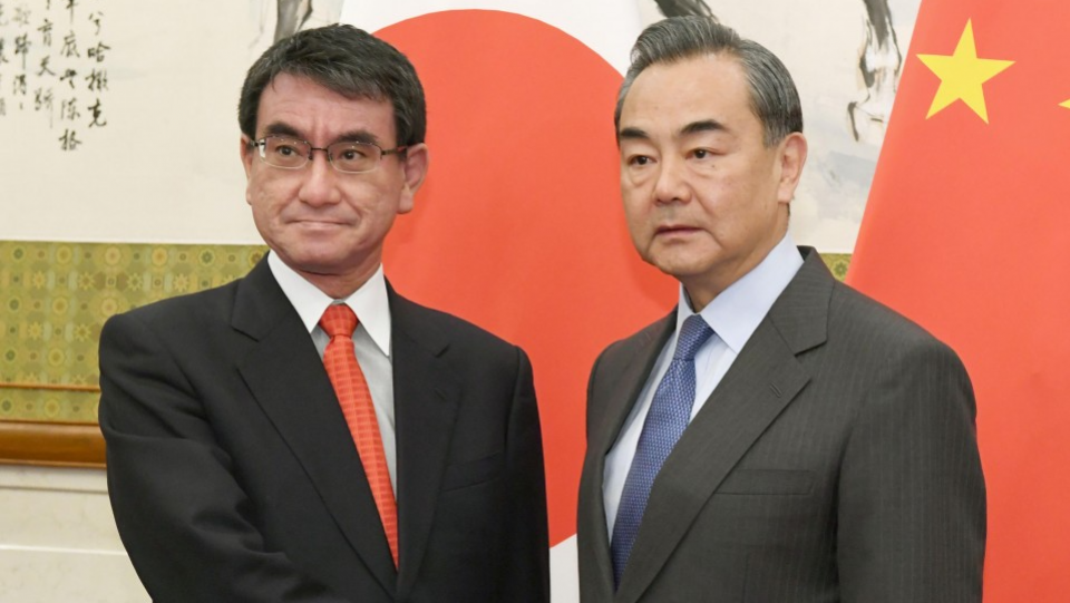 Japan, China vow to resume leaders' visits with ties improving