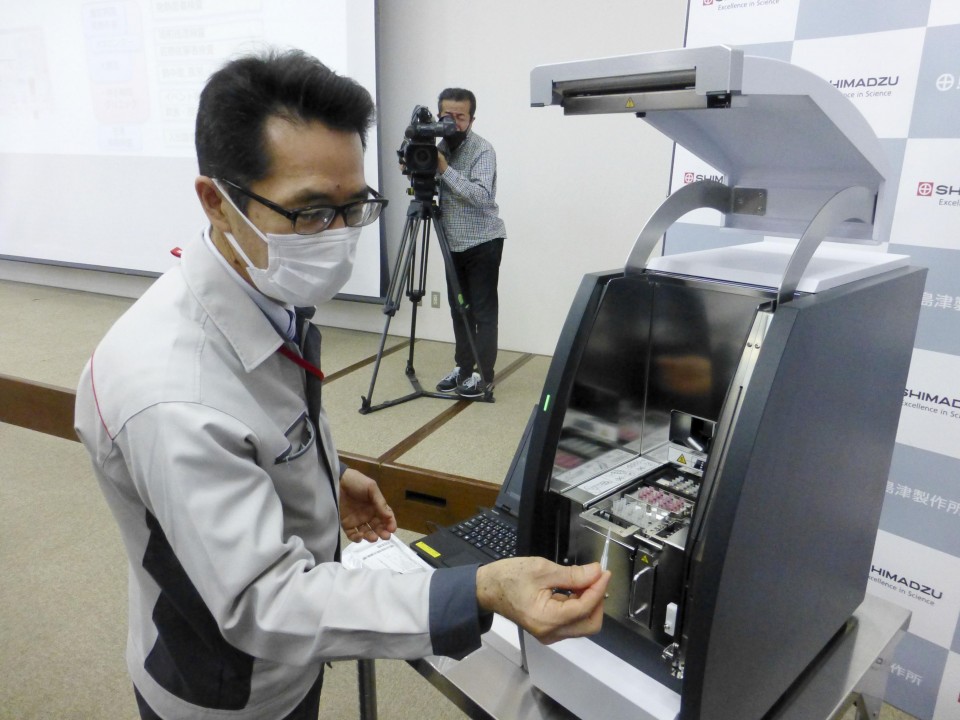 Japan's Shimadzu introduces lower-priced automated coronavirus test machine